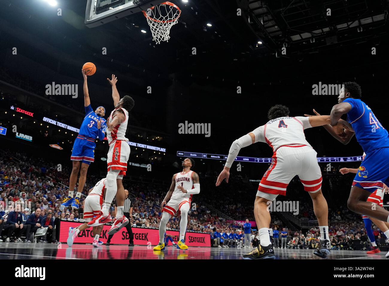 Kansas' Dajuan Harris Jr. (3) shoots over Arizona's Tobe Awaka during ...