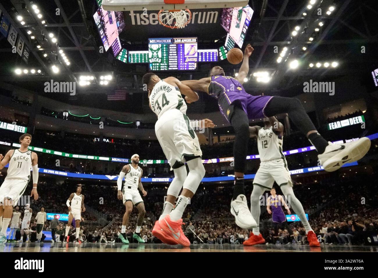 Milwaukee Bucks' Giannis Antetokounmpo stops a dunk by Los Angeles ...