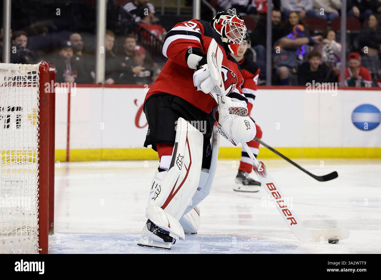 New Jersey Devils goaltender Jake Allen clears the puck during the ...