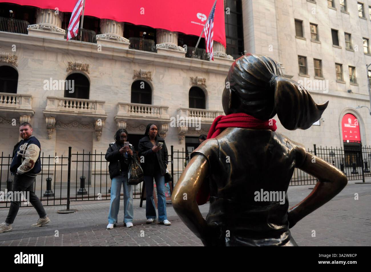 The "Fearless Girl" statue is seen in front of the New York Stock ...