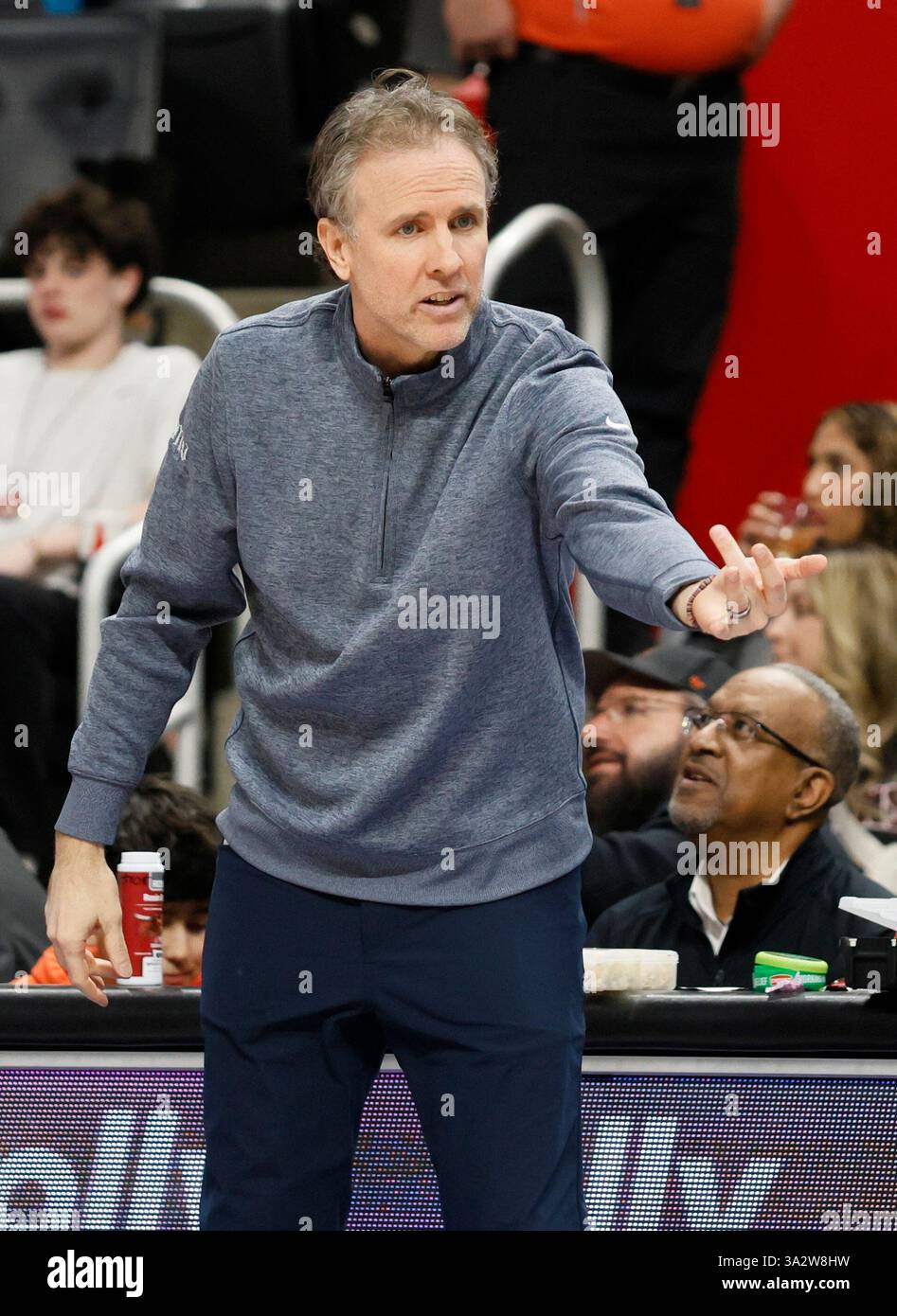 Washington Wizards head coach Brian Keefe directs one of his players ...