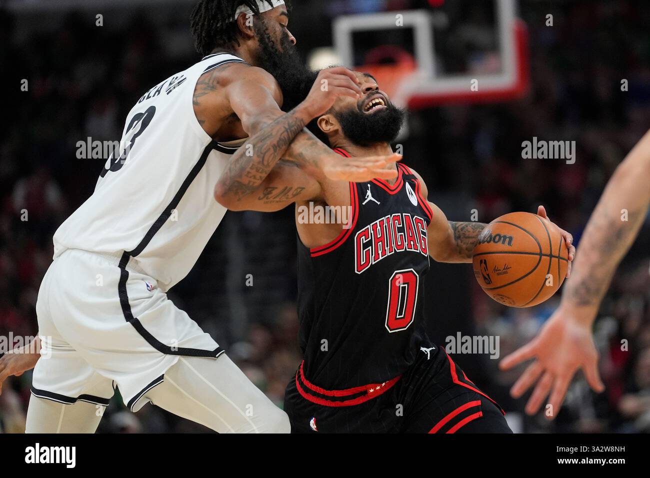 Brooklyn Nets center Nic Claxton, left, fouls Chicago Bulls guard Coby ...