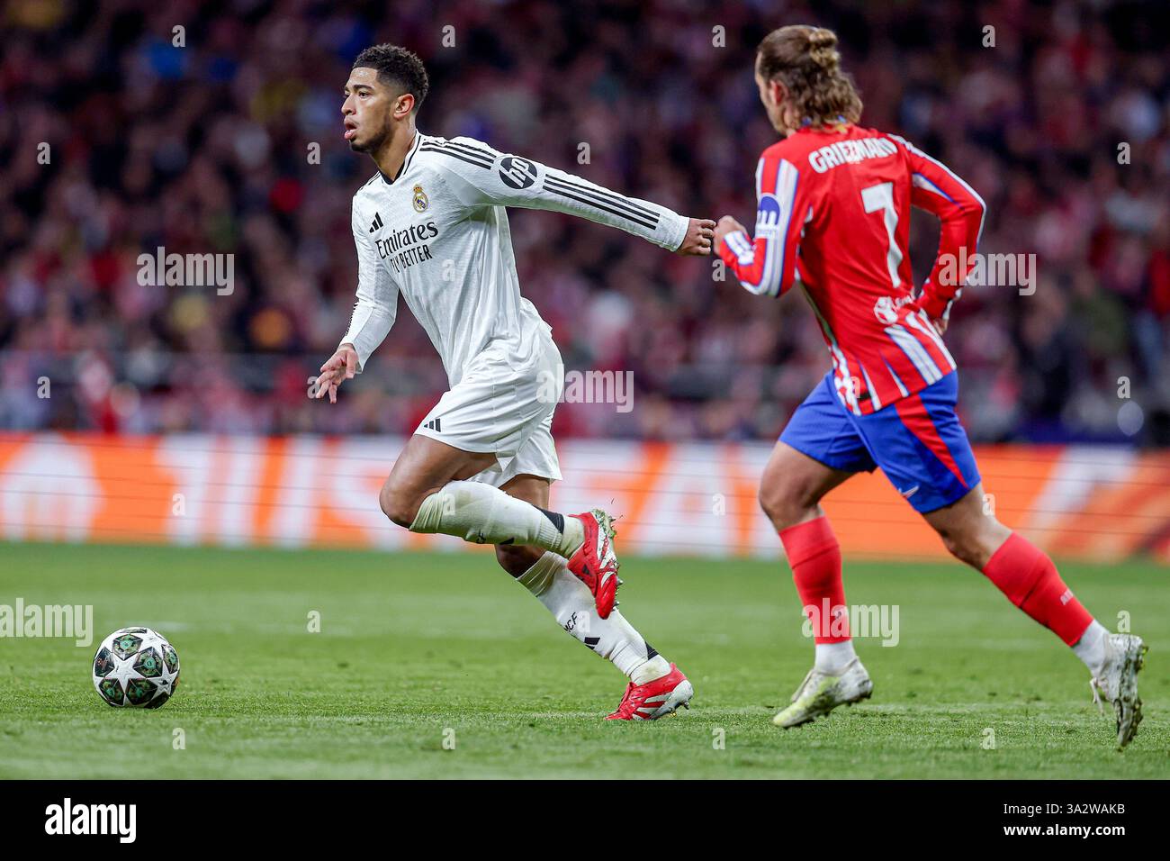 Madrid, Spain. 13th Mar, 2025. Jude Bellingham of Real Madrid and Antoine Griezmann of Atletico ...