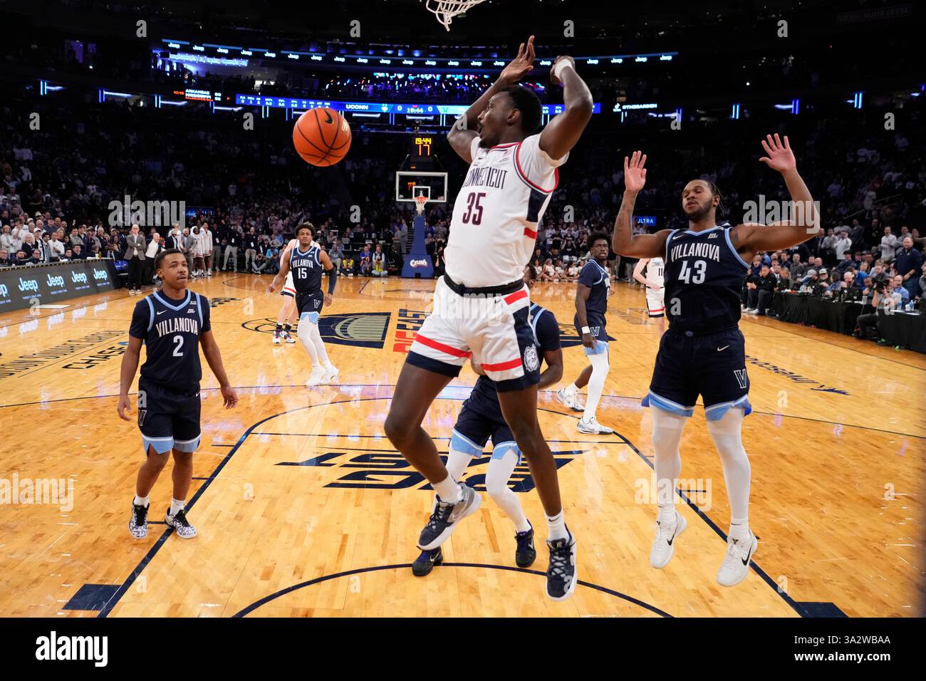 UConn's Samson Johnson (35) dunks the ball in front of Villanova's Eric ...