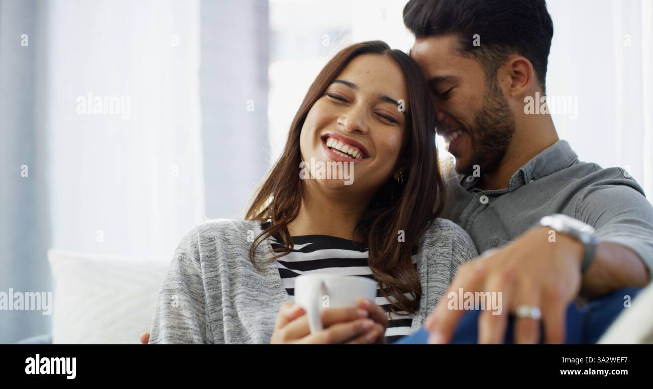 Chilling, laughing and couple with coffee, home and love in living room ...