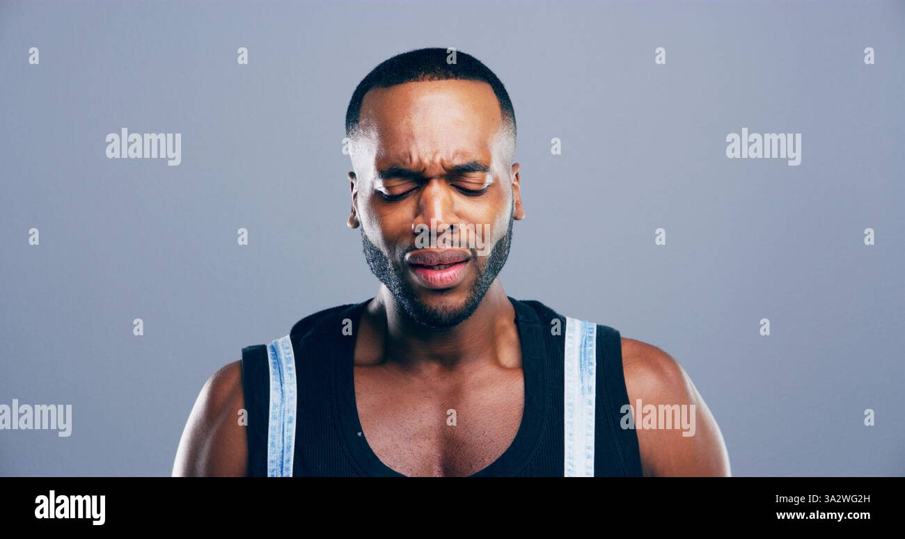 Sad, African man and crying tears in studio with depression, mourning ...