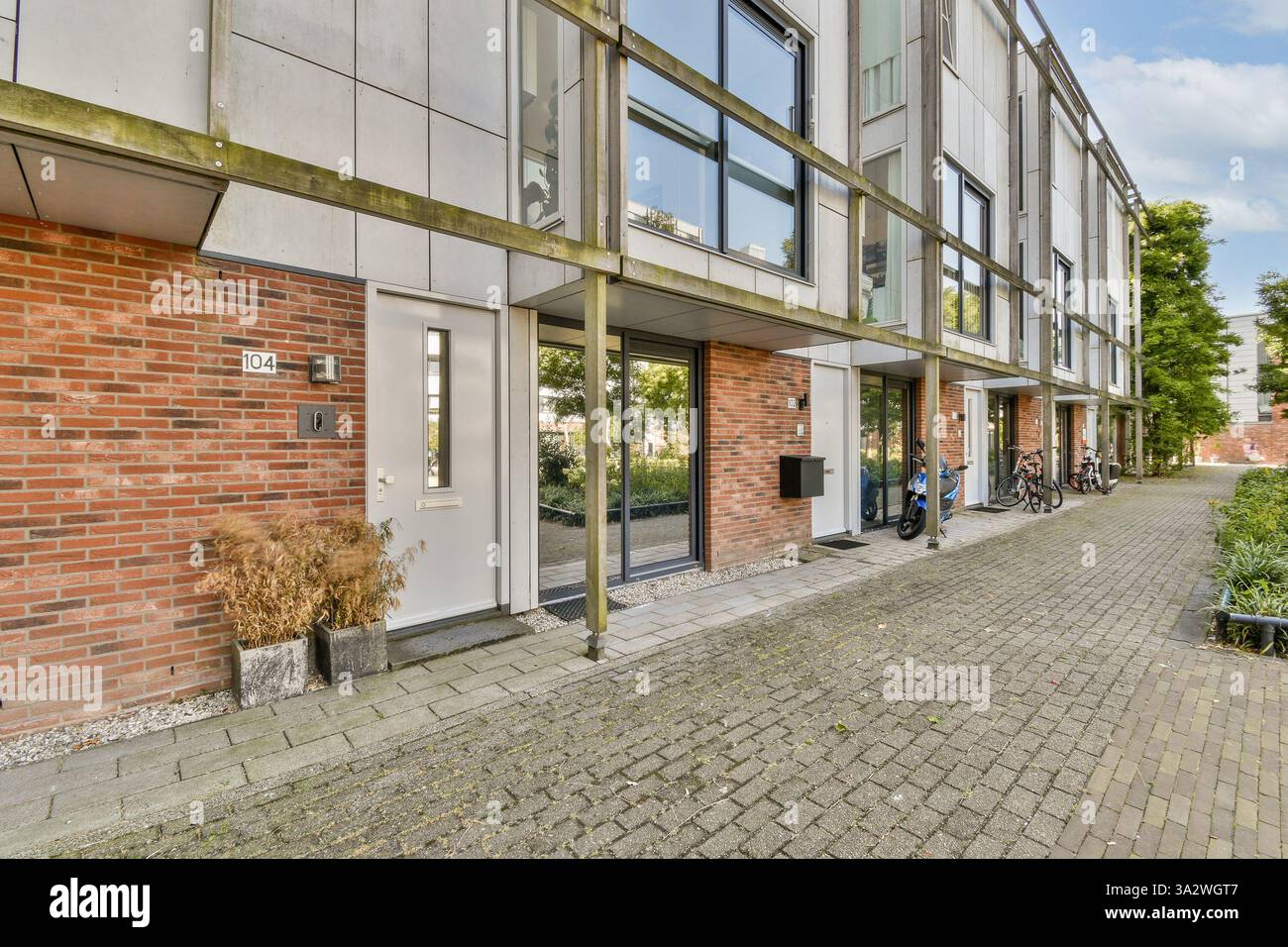 This image showcases a row of contemporary urban residential buildings ...