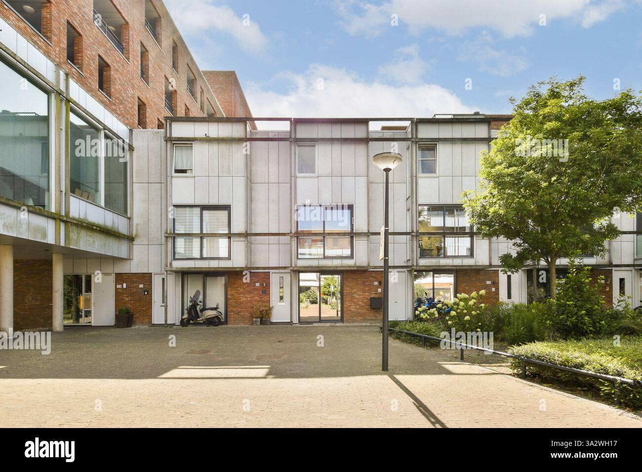 Contemporary building design featuring a mix of materials, with an ...