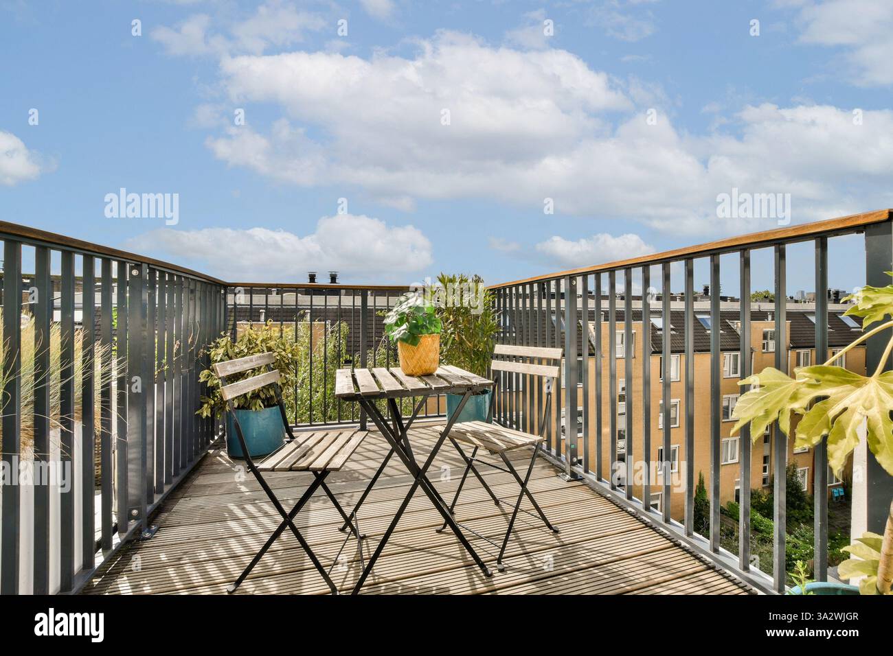 A charming rooftop terrace featuring modern furniture, potted plants ...