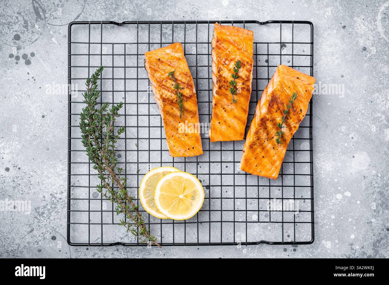 Grilled salmon fillet steak, roast fish on a rack. grey background. top ...