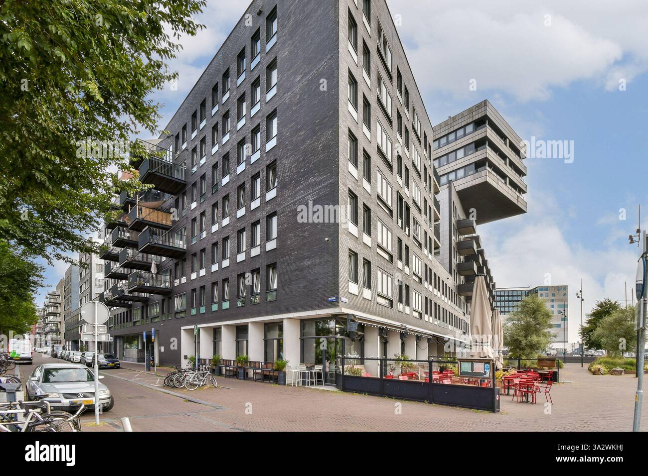 A contemporary building featuring unique angles, large windows, and a ...