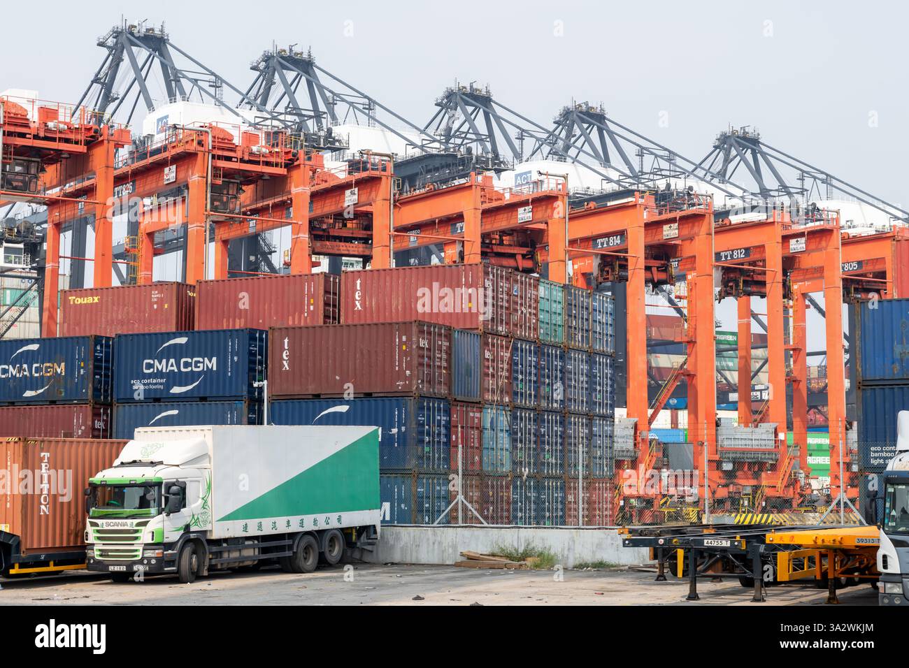 Hong Kong. China- 02.18.2025. Ship to shore cranes, stacks of shipping ...