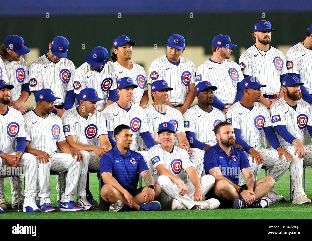 Chicago Cubs players pose for a commemorative photo before official ...