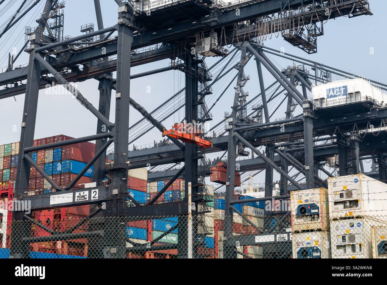 Hong Kong. China- 02.18.2025. Ground view of port cranes loading ...
