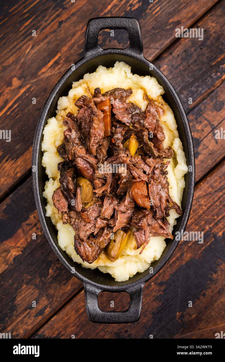 Braised Beef Cheek, Slow cooked meat with smashed potatoes in a skillet ...