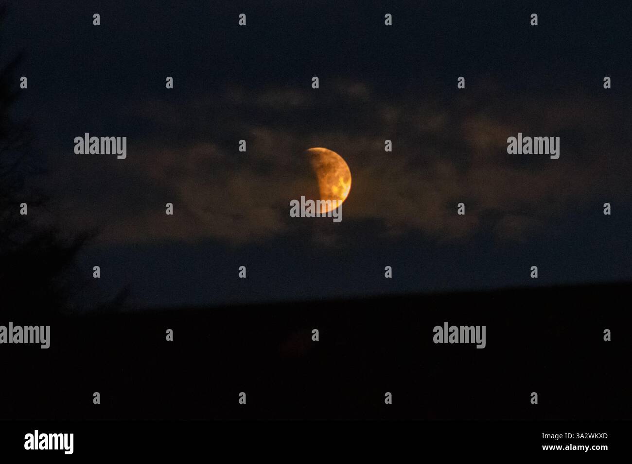 Fordingbridge, Hampshire, England, UK, 14th March 2025. A partial lunar ...