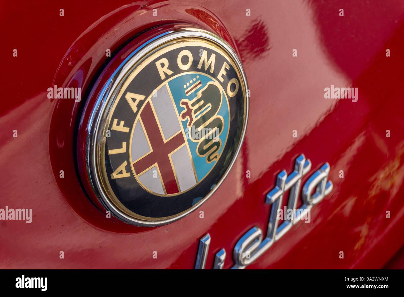 A close-up view of an Alfa Romeo emblem featuring intricate designs in ...