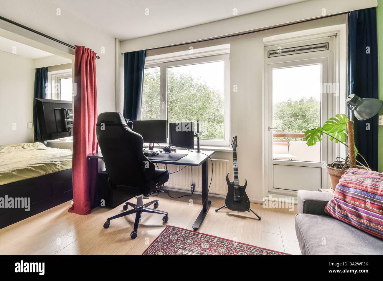 A modern home office setup featuring a desk with computer monitors, a ...