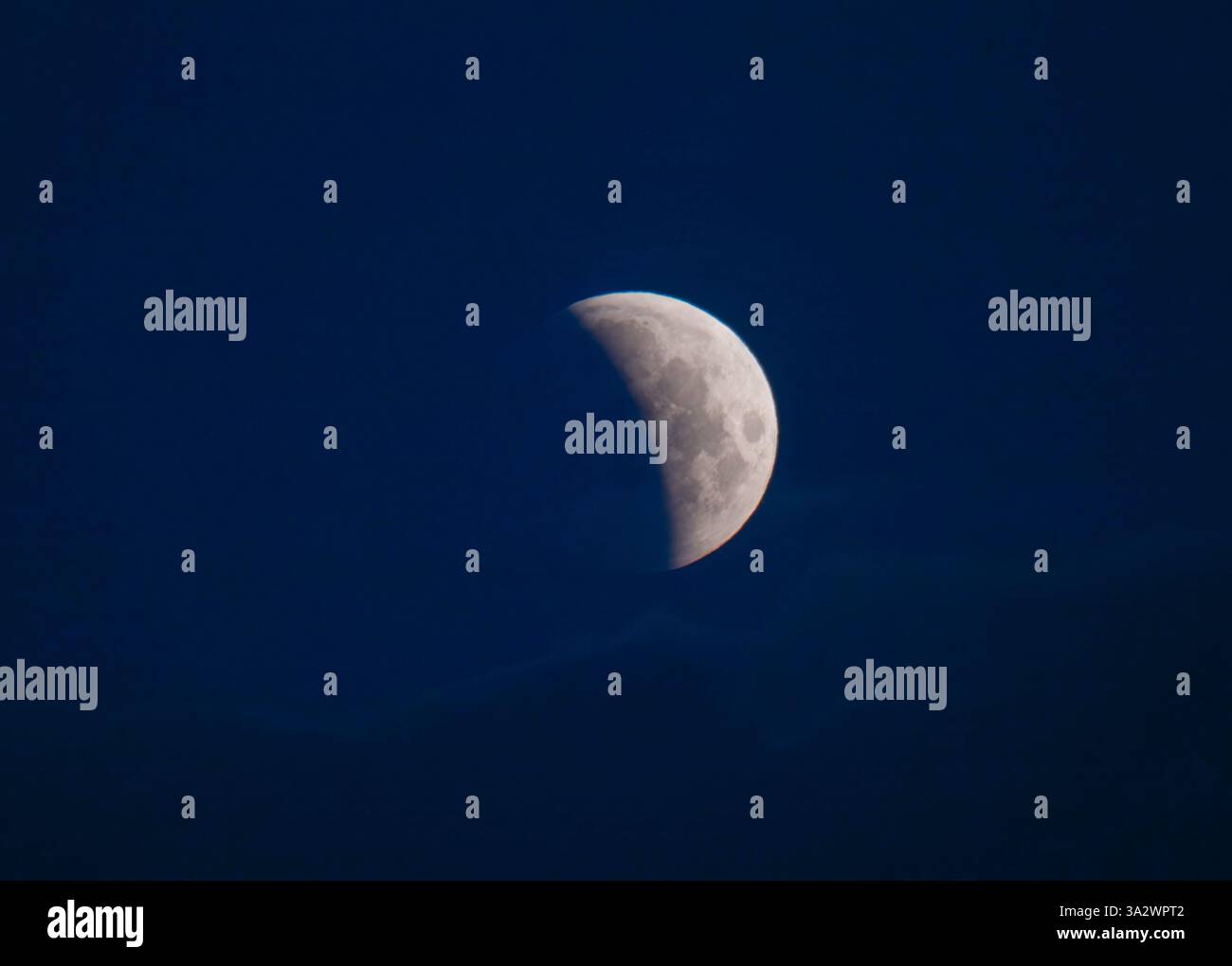 London, UK. 14th March, 2025. The partial lunar eclipse in progress as ...