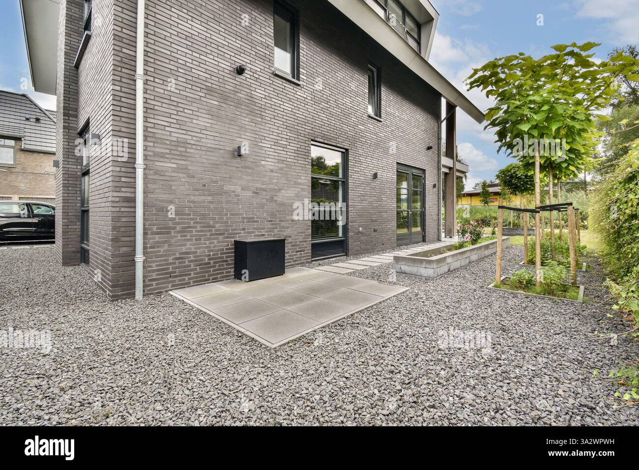 A contemporary house featuring sleek designs and a well-manicured ...