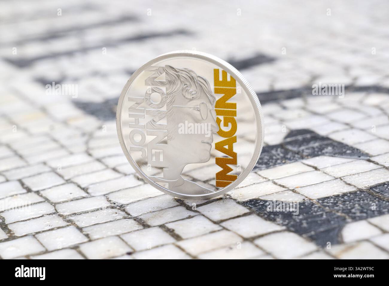 EDITORIAL USE ONLY A collectable coin featuring John Lennon and the ...