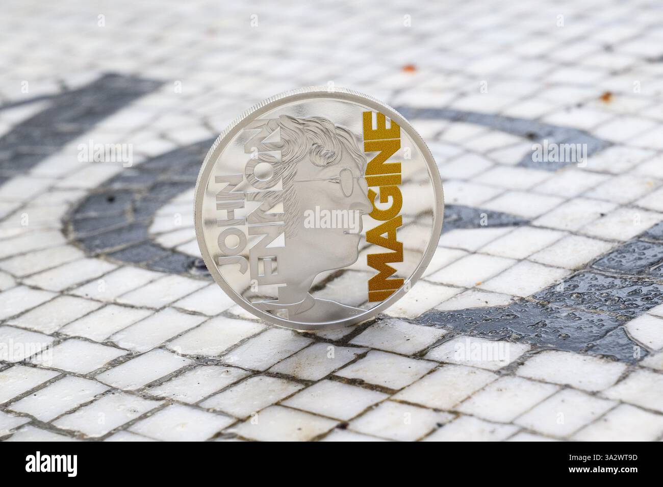 EDITORIAL USE ONLY A collectable coin featuring John Lennon and the ...