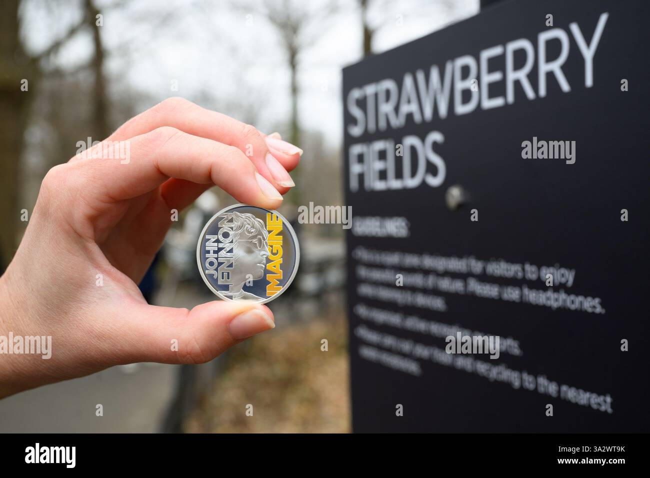 EDITORIAL USE ONLY A collectable coin featuring John Lennon and the ...