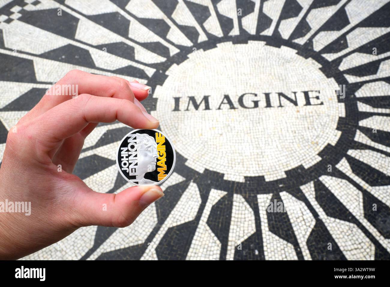 EDITORIAL USE ONLY A collectable coin featuring John Lennon and the ...