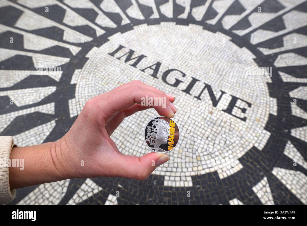 EDITORIAL USE ONLY A collectable coin featuring John Lennon and the ...