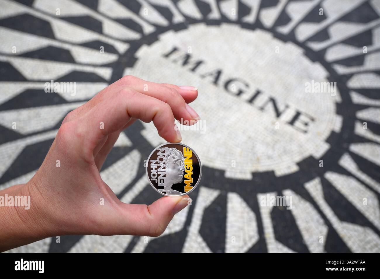 EDITORIAL USE ONLY A collectable coin featuring John Lennon and the ...