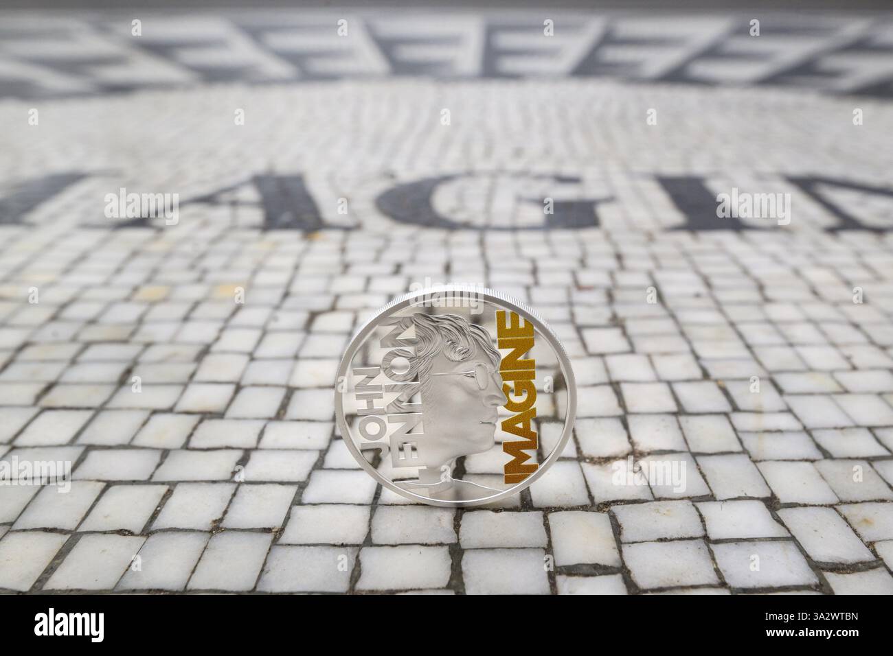 EDITORIAL USE ONLY A collectable coin featuring John Lennon and the ...