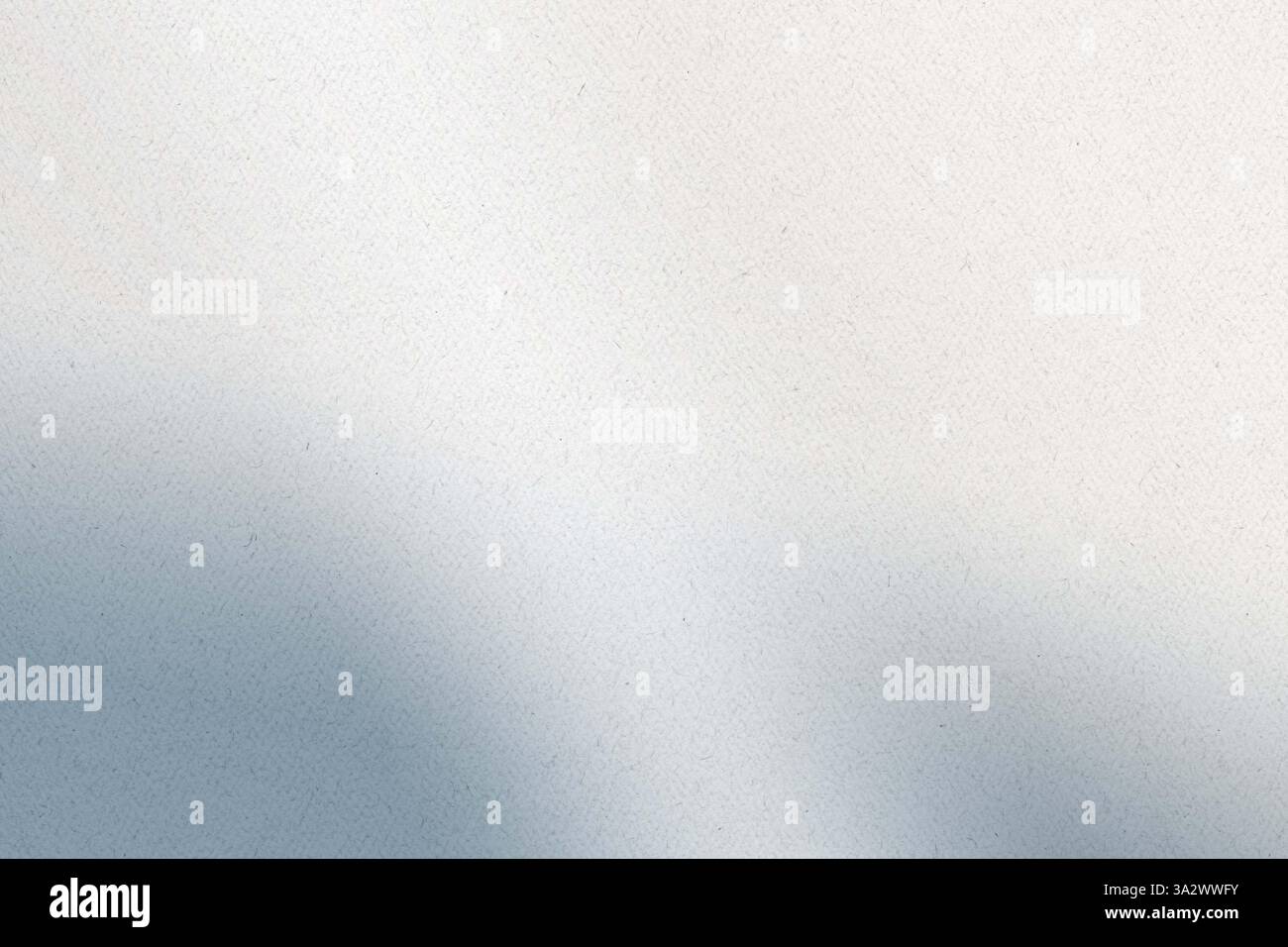 A faint, soft shadow is cast on a white piece of paper, creating a ...