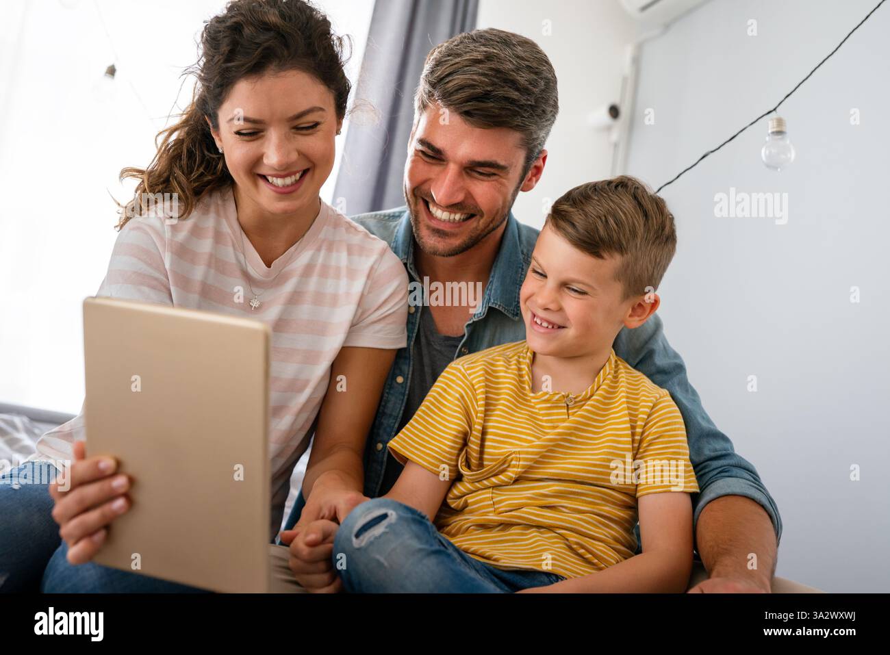 Happy family, parents with cute excited small kids son using laptop ...