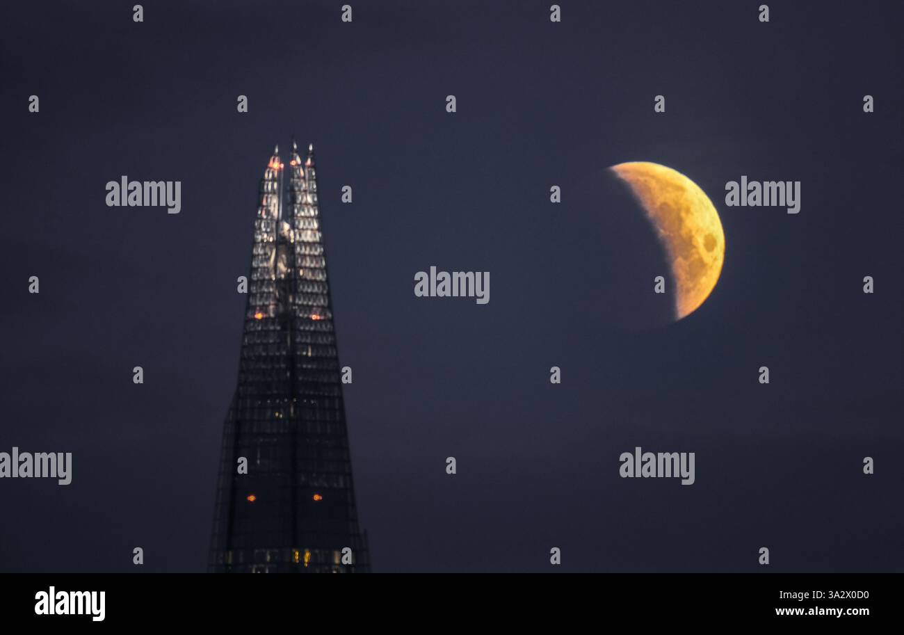 Partial blood moon lunar eclipse over The Shard, London, 14th March ...