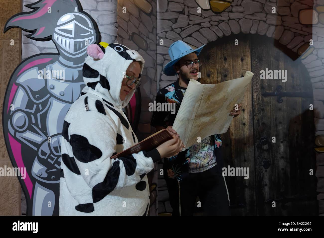 JERUSALEM - MARCH 13: People wear costumes as they read the Book of ...