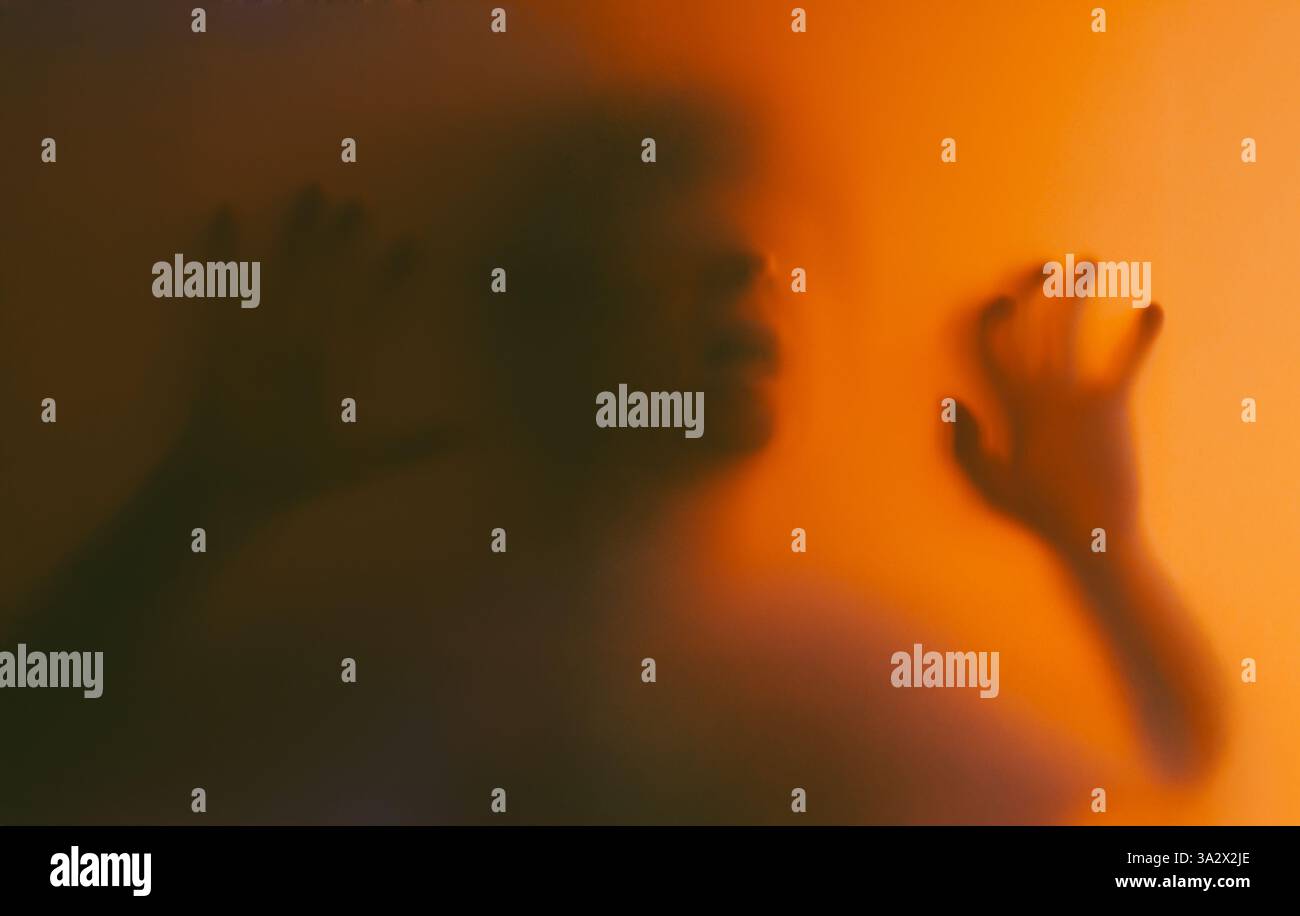 Ethereal abstract image featuring a blurred figure pressing hands ...