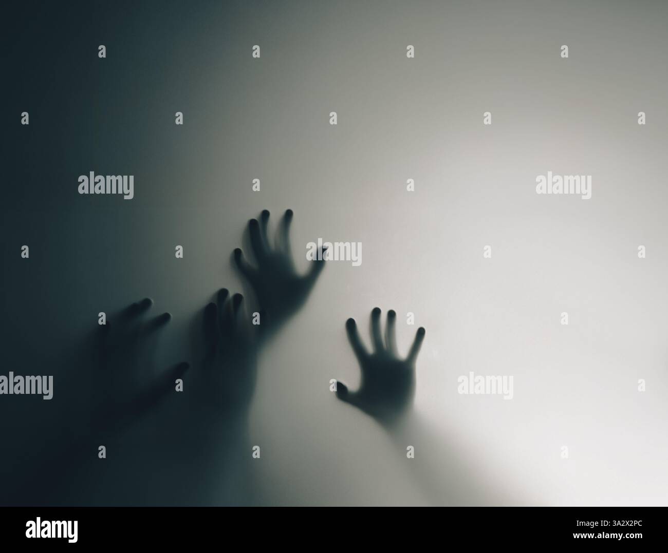 Silhouetted hands appear behind a translucent material, creating an ...