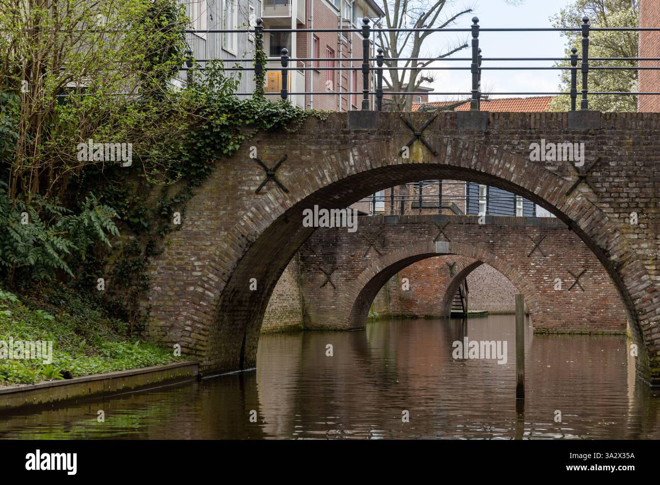 The Binnendieze canal with multiple bridges in the centre of the ...