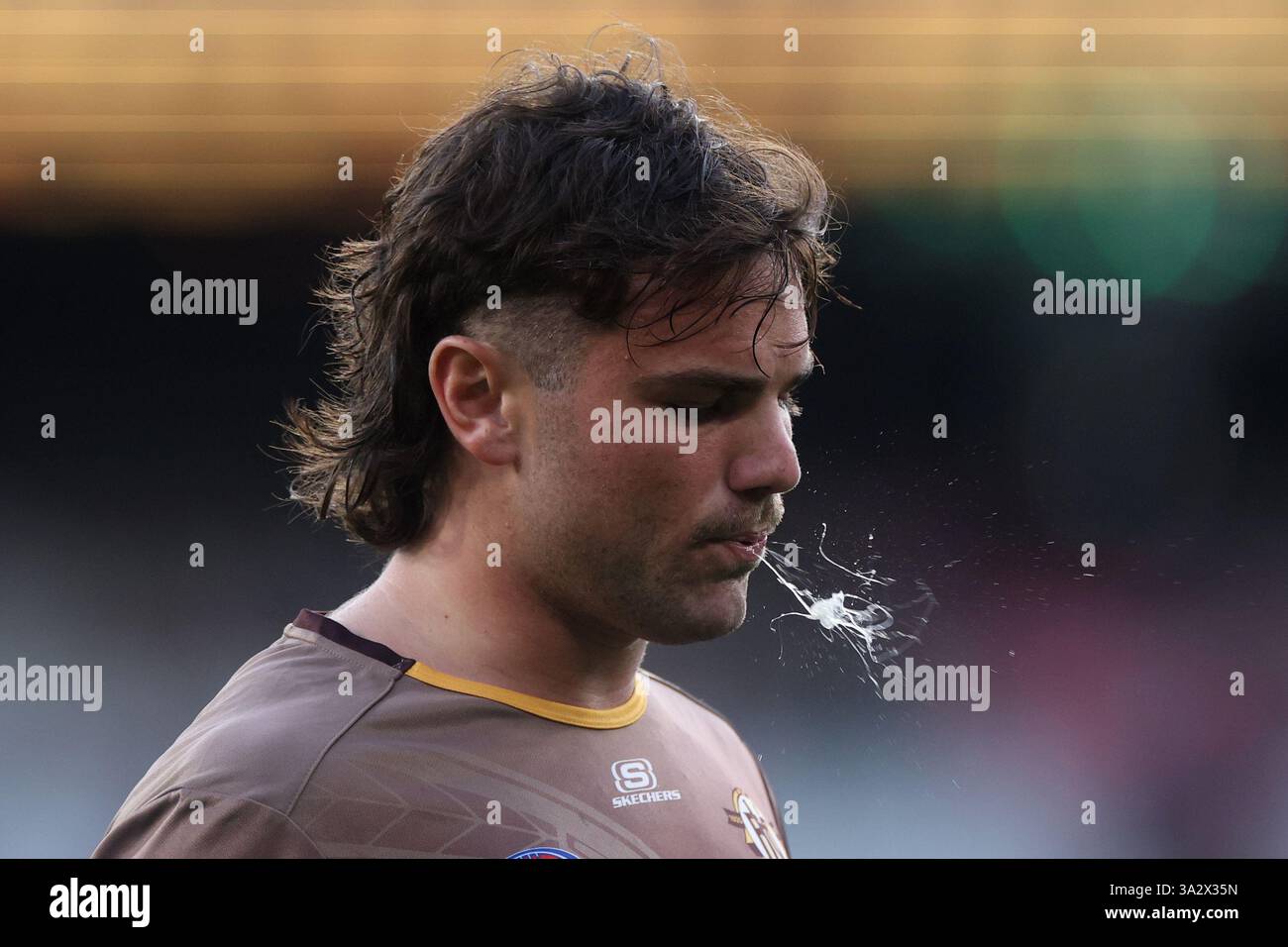 Nick Watson of the Hawks warms up ahead of the AFL Round 1 match ...
