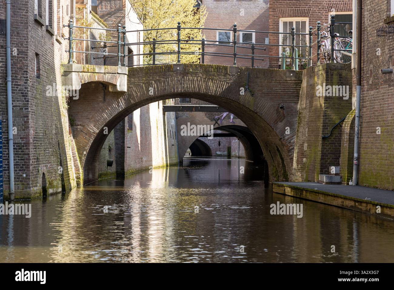 The Binnendieze canal with multiple bridges in the centre of the ...