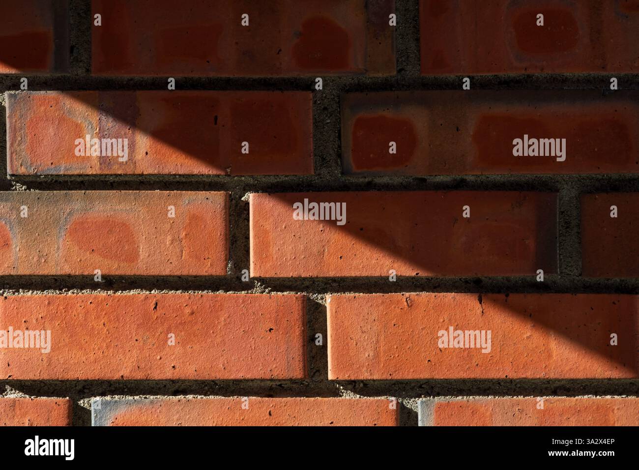 An interesting play of shadows creates sharp triangular shapes across a ...