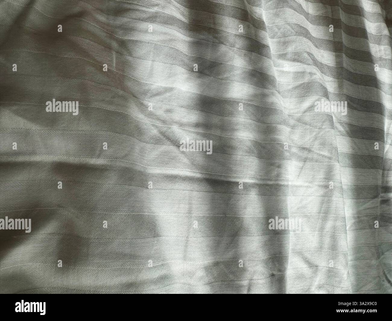 Fabric with subtle texture and light pattern in a neutral shade on a ...