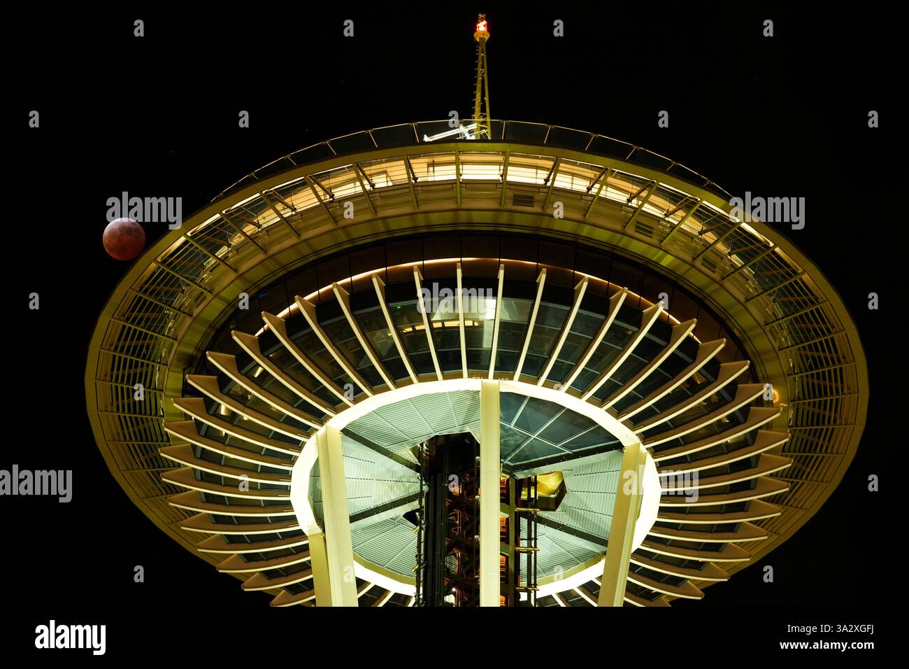 A total lunar eclipse is seen over the Space Needle, Thursday, March 13 ...