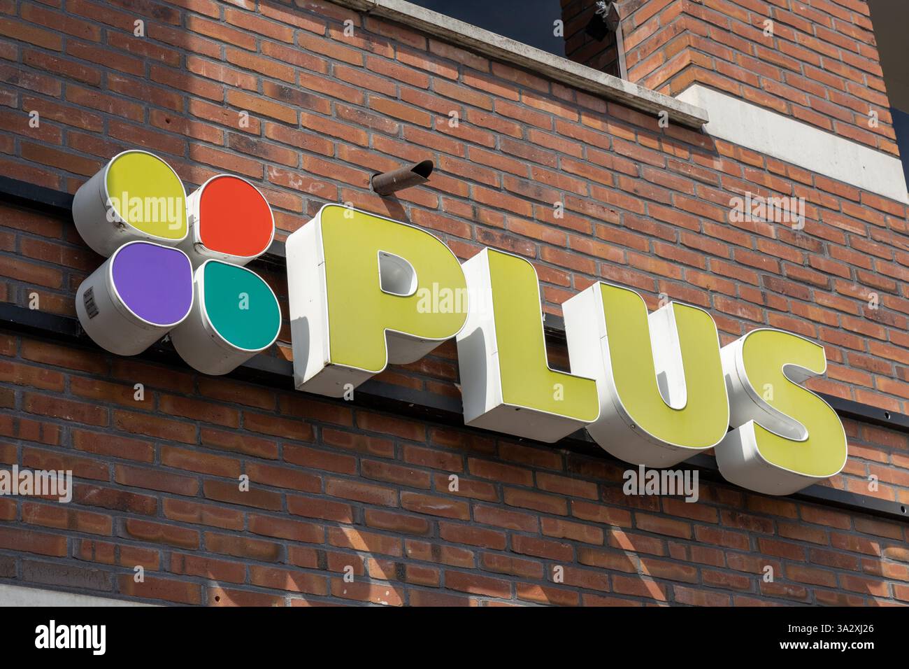Plus logo sign. Plus is a supermarket groceries store Stock Photo - Alamy