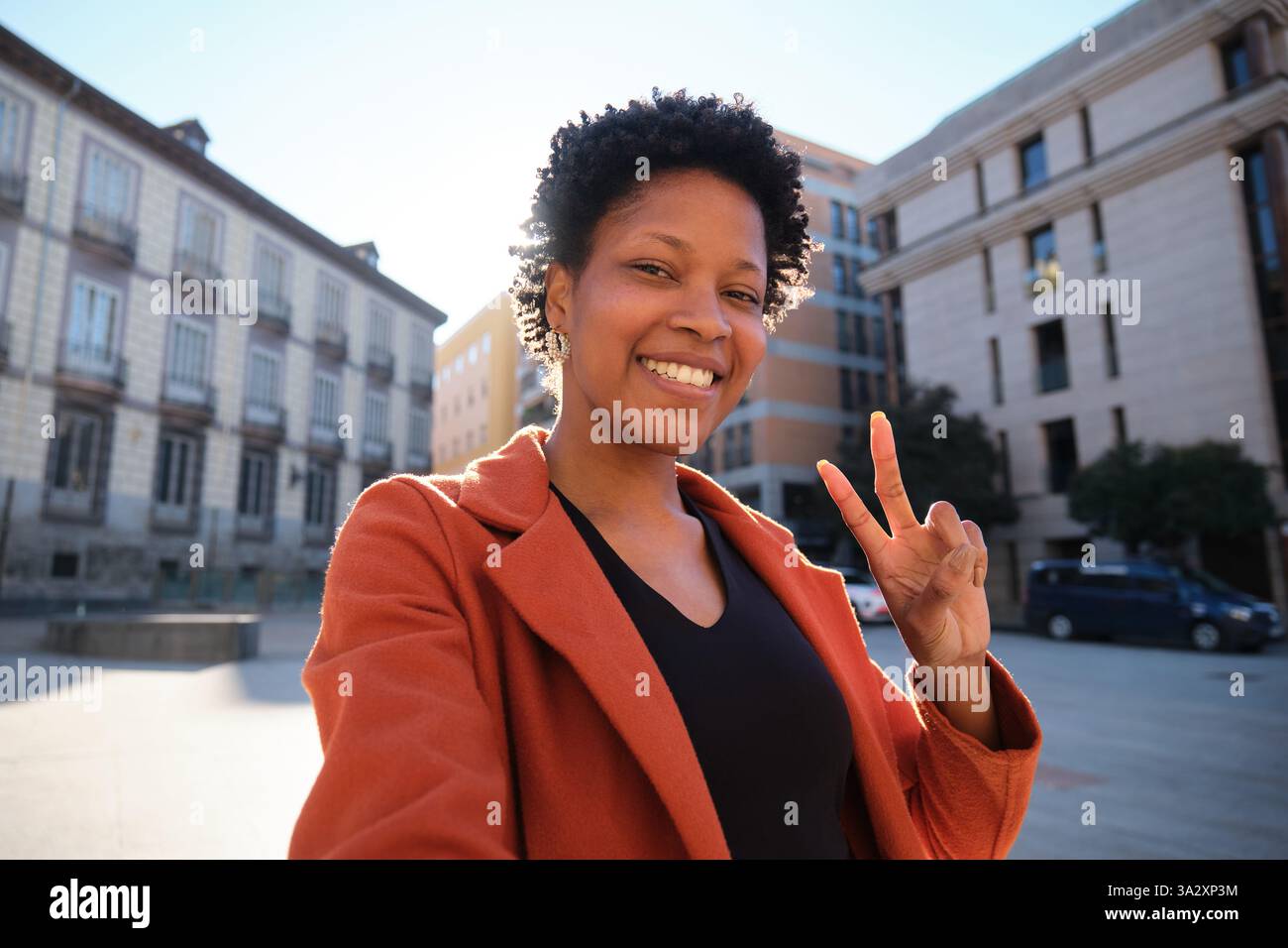 Woman making peace sign hi-res stock photography and images - Alamy