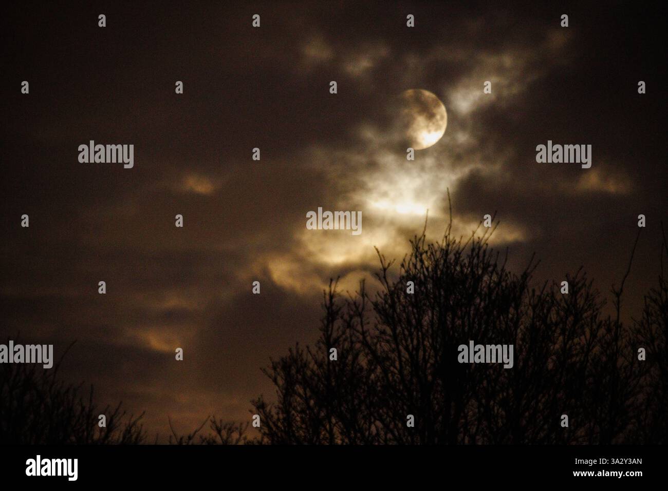 The Worm Moon begins the total eclipse above London Stock Photo - Alamy