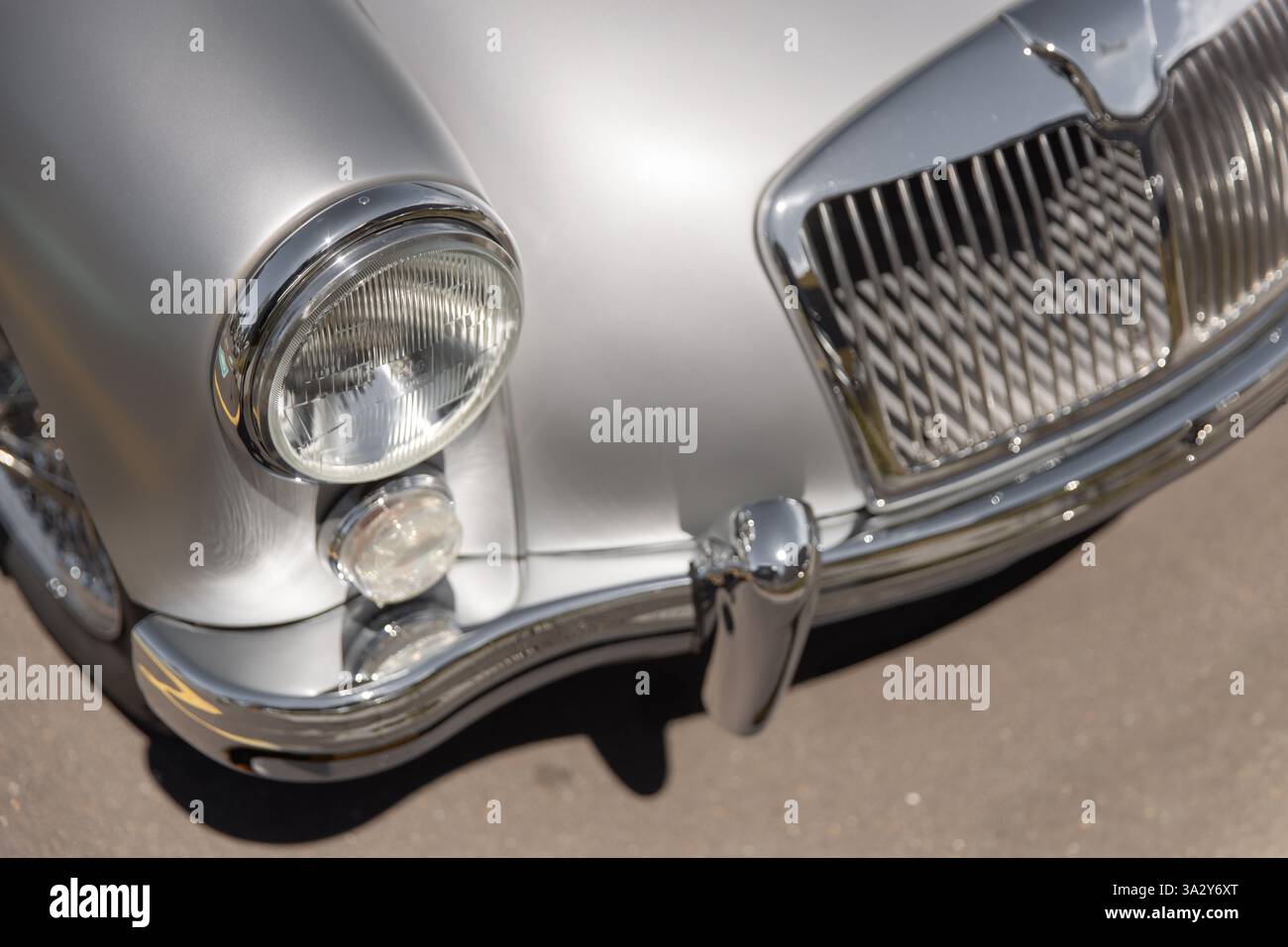 Front grille and headlight of a matte silver British vintage car Stock ...
