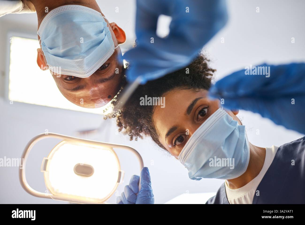 Dentists masking hi-res stock photography and images - Alamy