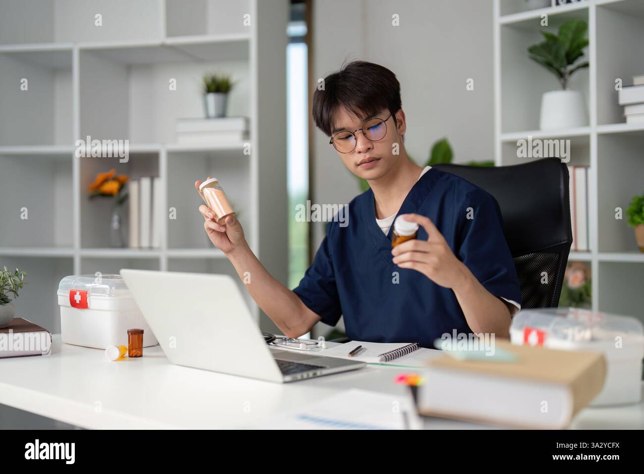 Medication Review and Study. A medical student analyzing prescription ...