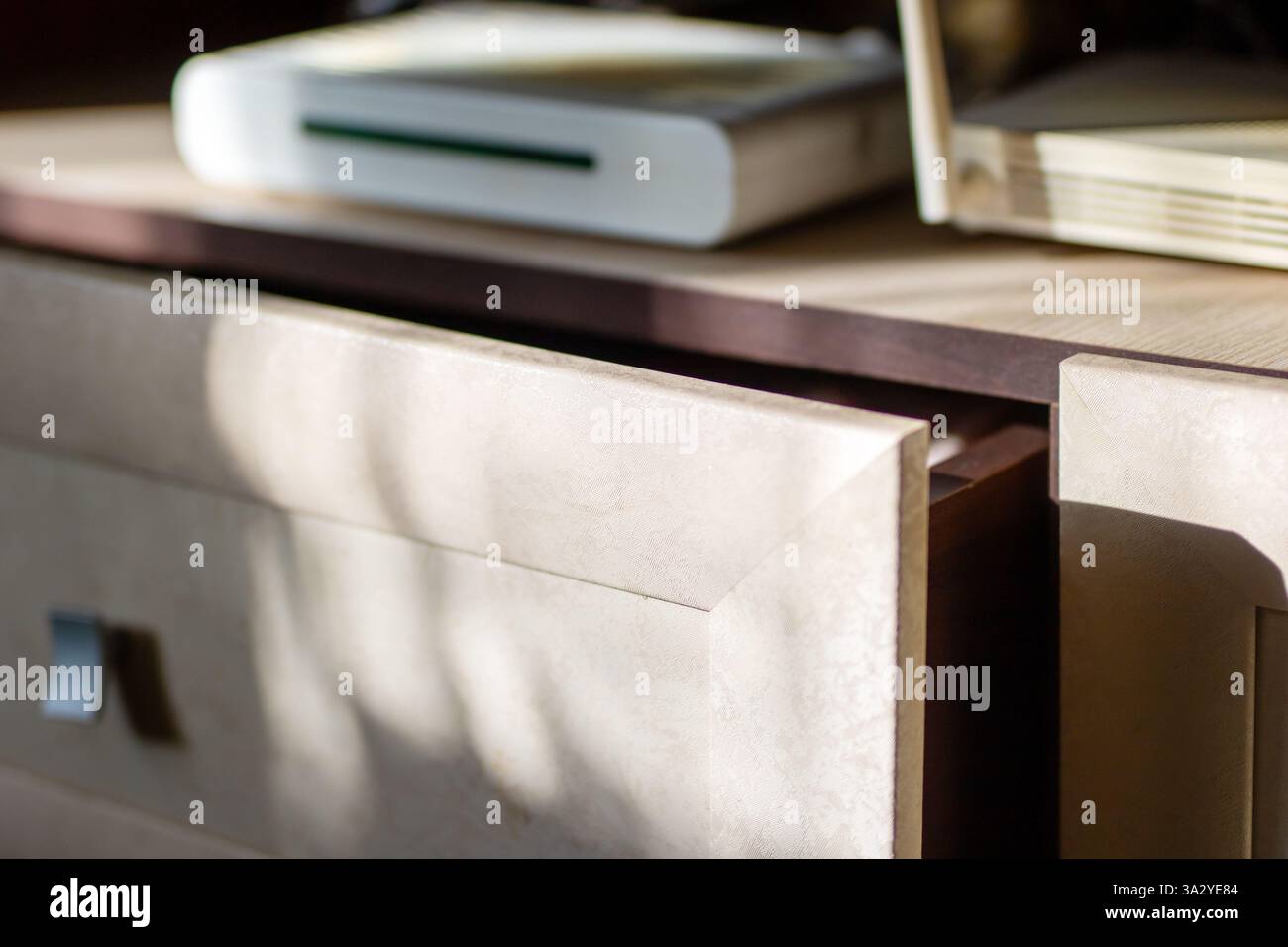 A beautifully crafted book rests on a sturdy table that is conveniently ...